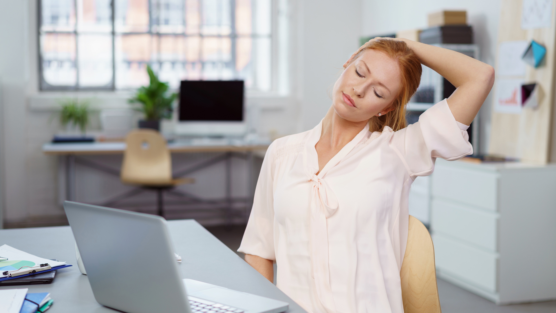7 desk stretches to ease back pain | The GoodLife Fitness Blog